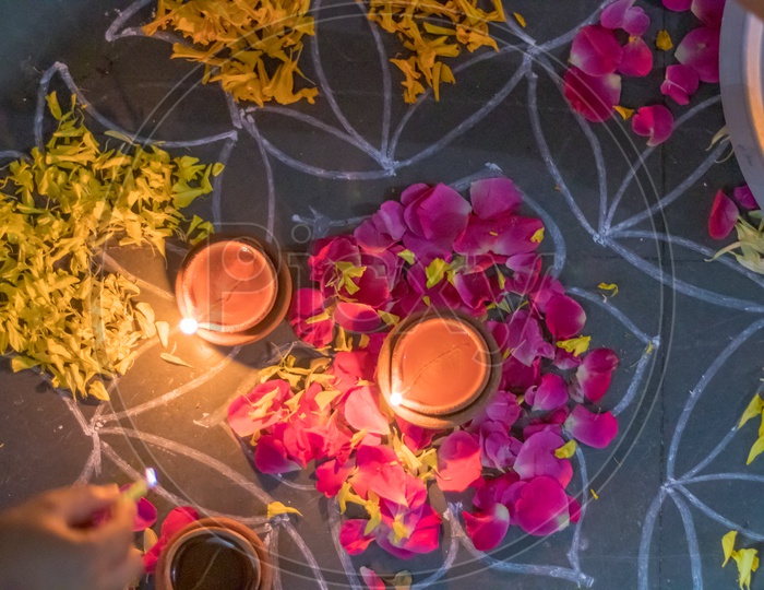Image Of Indian Hindu Festival Diwali Dias Lighting Up By Women Closeup