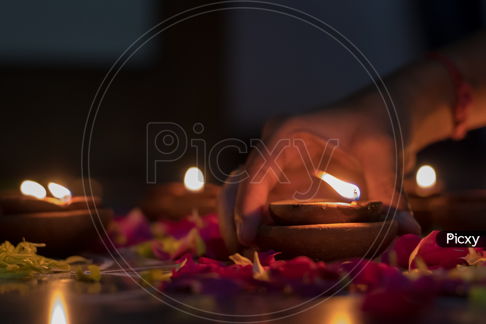 Image Of Indian Hindu Festival Diwali Dias Lighting Up By Women Closeup
