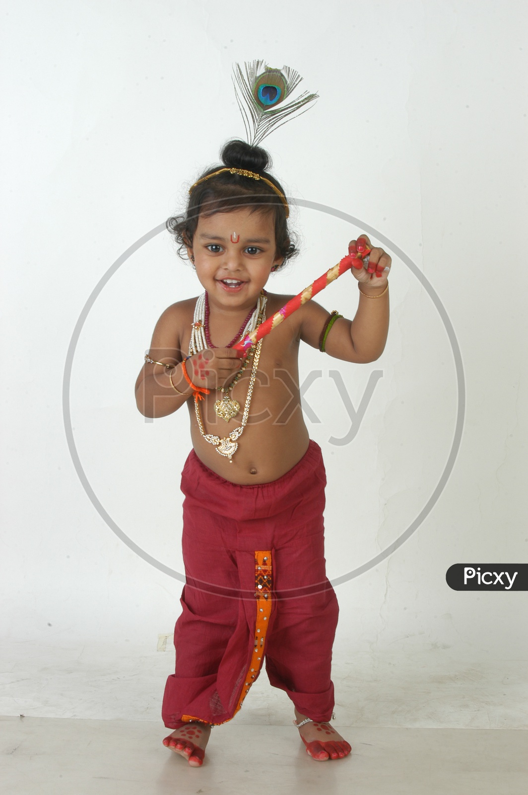 Image of A Cute Indian Boy in a Hindu God Sri Krishna Getup-PS972159-Picxy