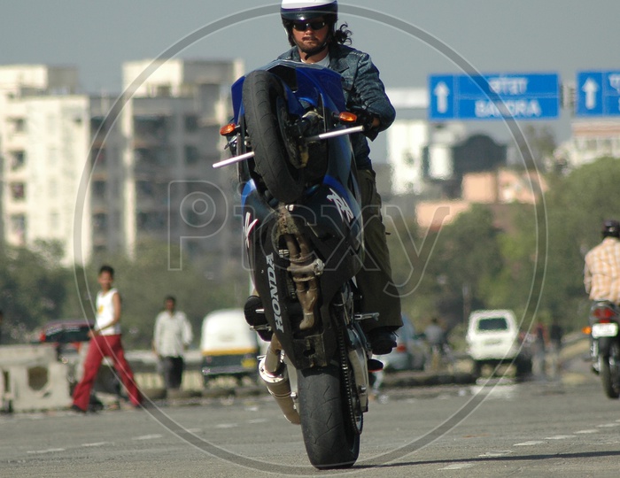 Image of Bike Stunts Performing By a Professional For a Movie Sequence ...