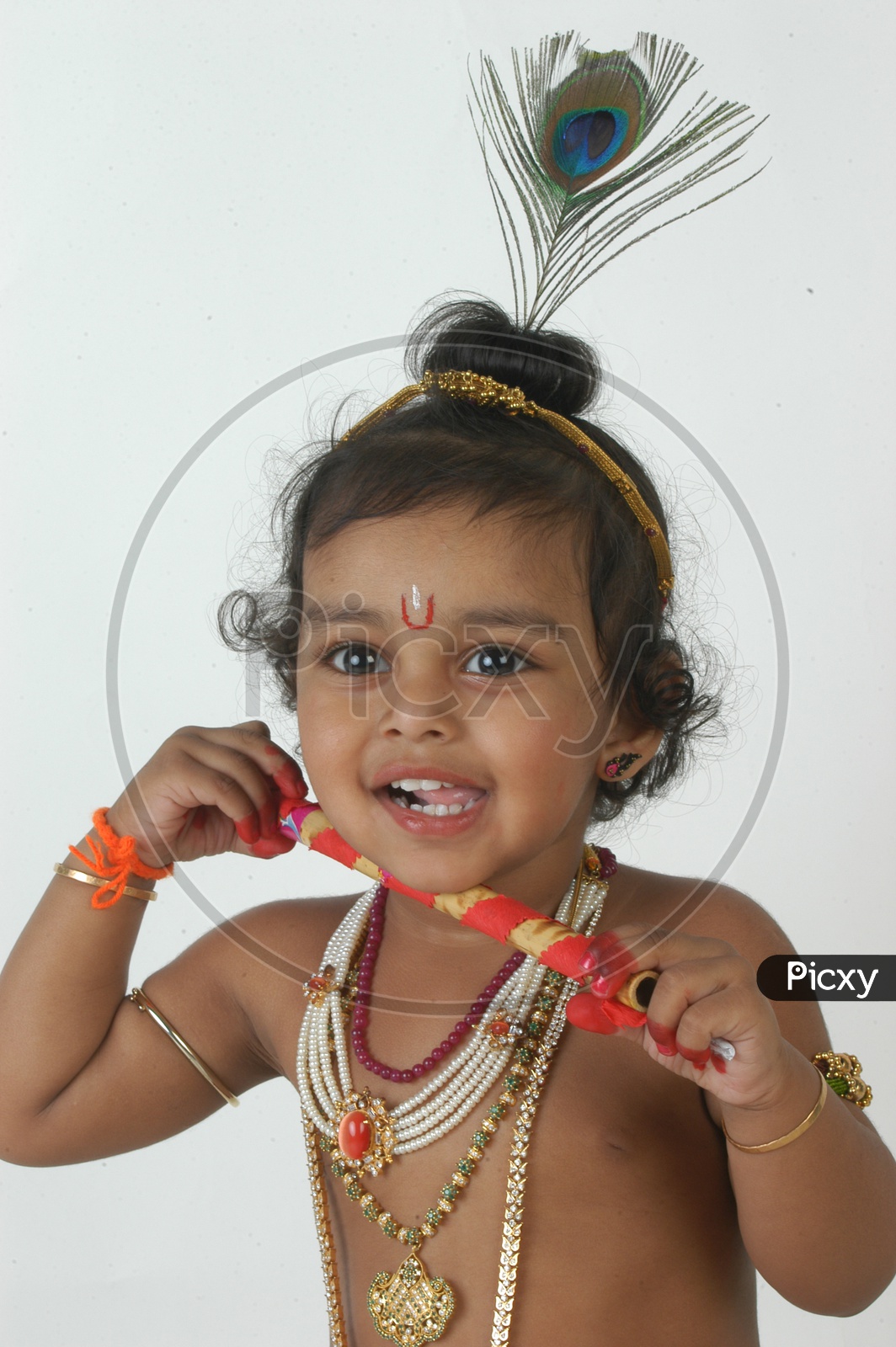 Image of A Cute Indian Boy in a Hindu God Sri Krishna Getup-OO597008-Picxy