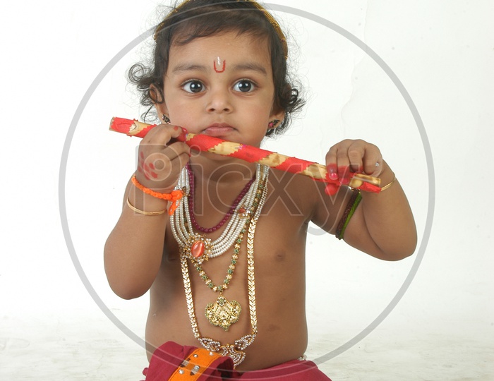 Image of A Cute Indian Boy in a Hindu God Sri Krishna Getup-DS882503-Picxy