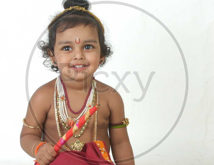 Image of A Cute Indian Boy in a Hindu God Sri Krishna Getup-PS972159-Picxy