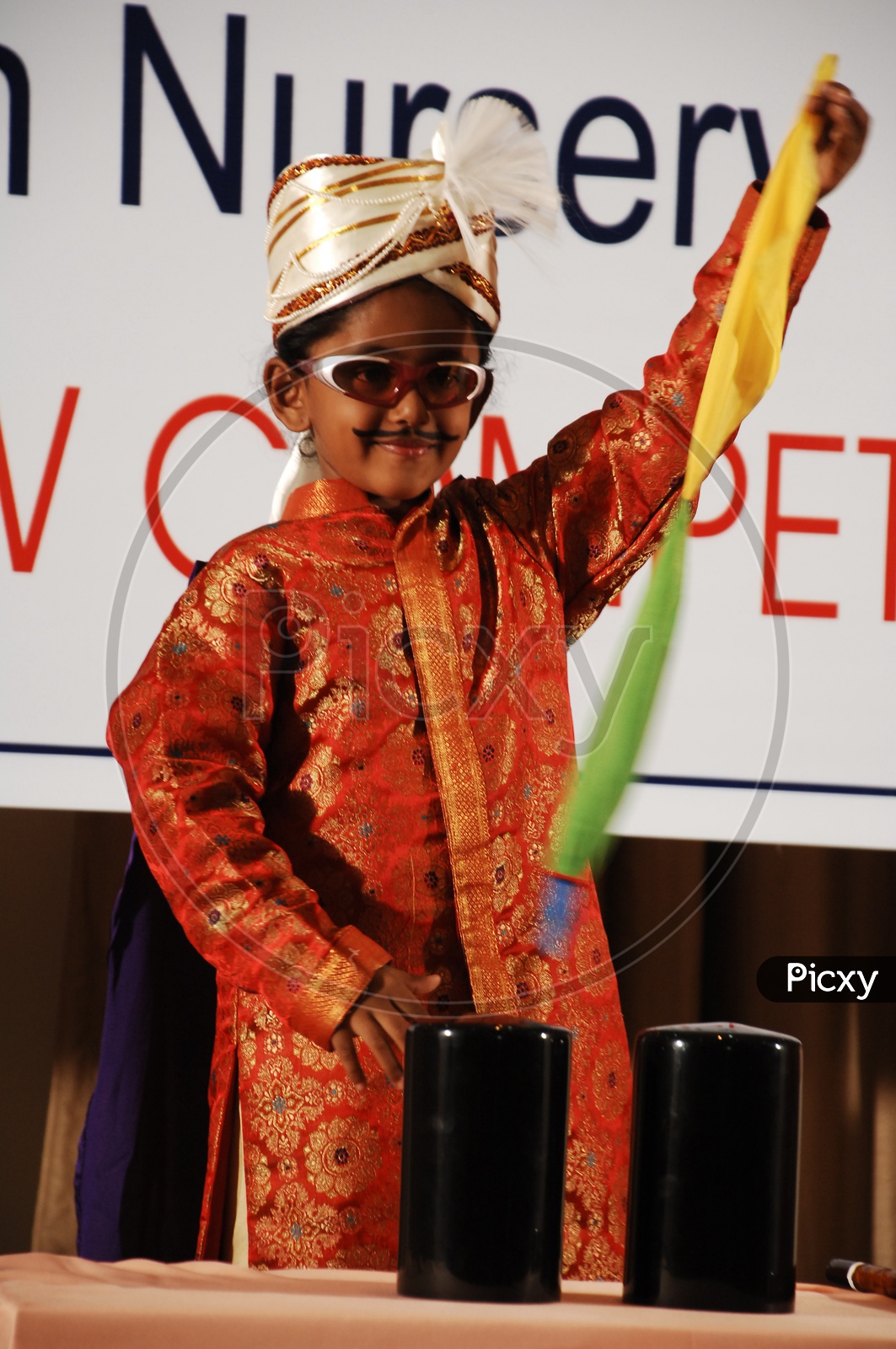 Image of Indian Girl Child Performing Magic tricks-KT999896-Picxy