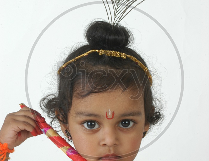 Image of A Cute Indian Boy in a Hindu God Sri Krishna Getup-YU392240-Picxy