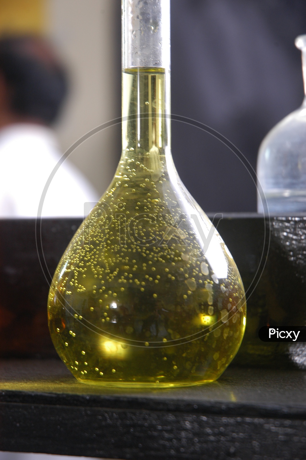 Image of Yellow Coloured Chemical in a Glass Container / beaker ...