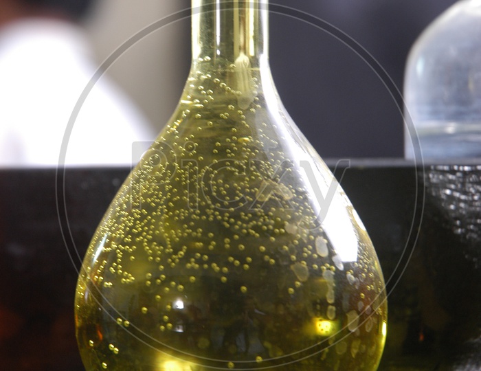 Image of Yellow Coloured Chemical in a Glass Container / beaker ...