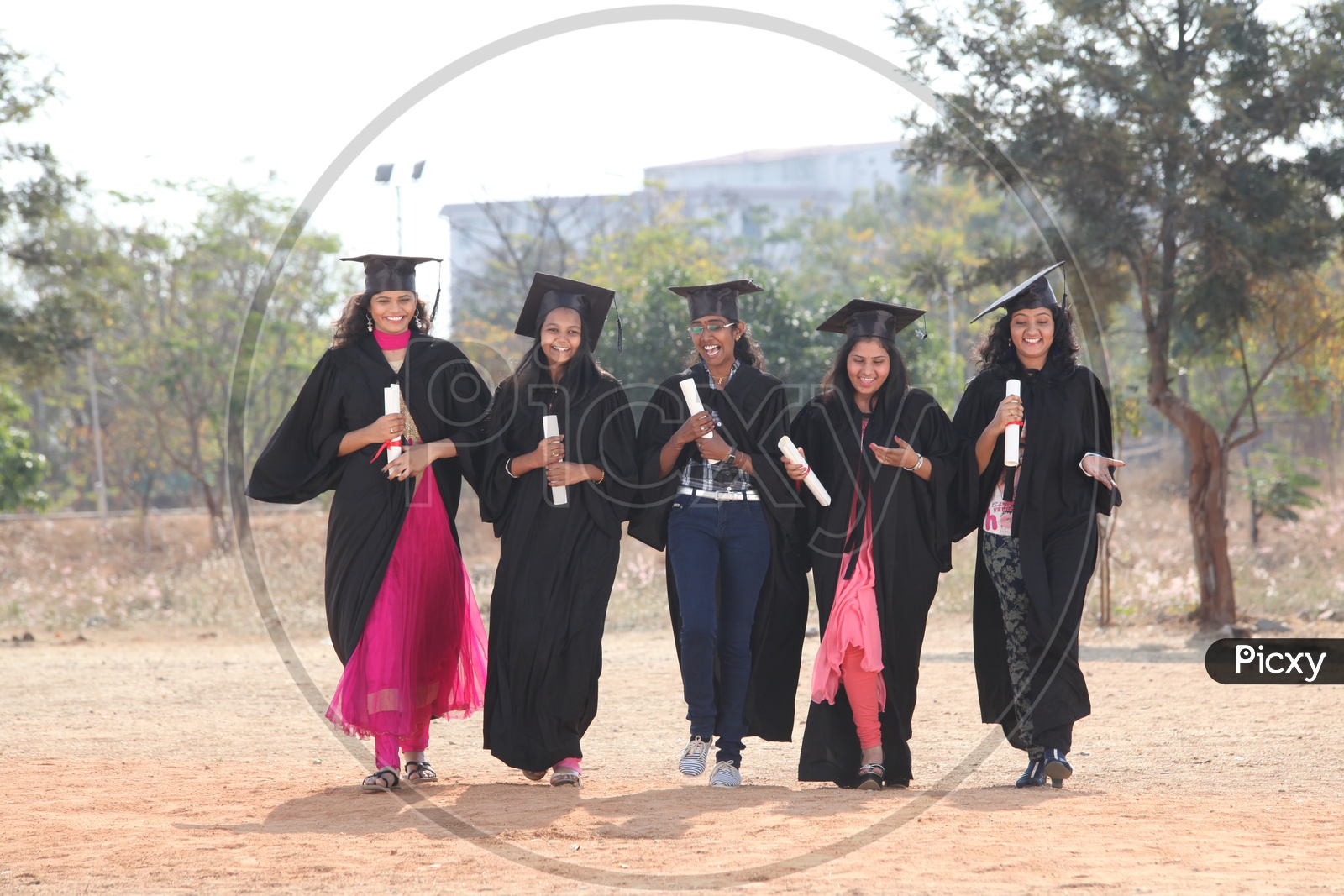 Image of Indian Young Girls On Graduation Suits Walking On a Campus ...