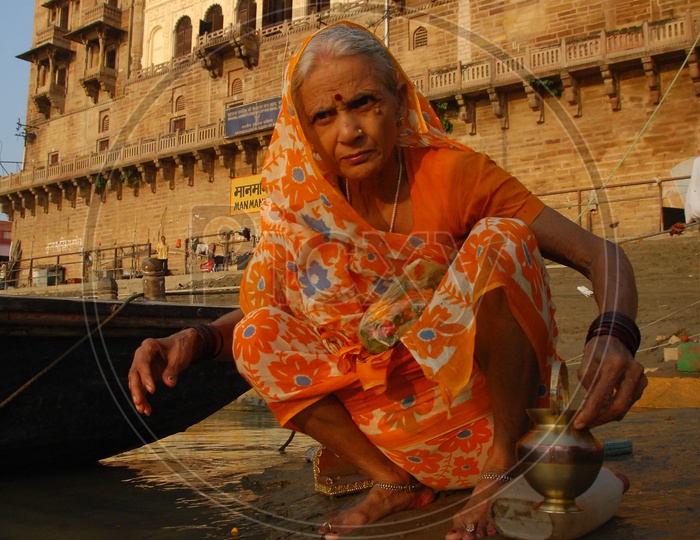 Image of Photograph of a old women doing pooja / People Face-KA283344-Picxy