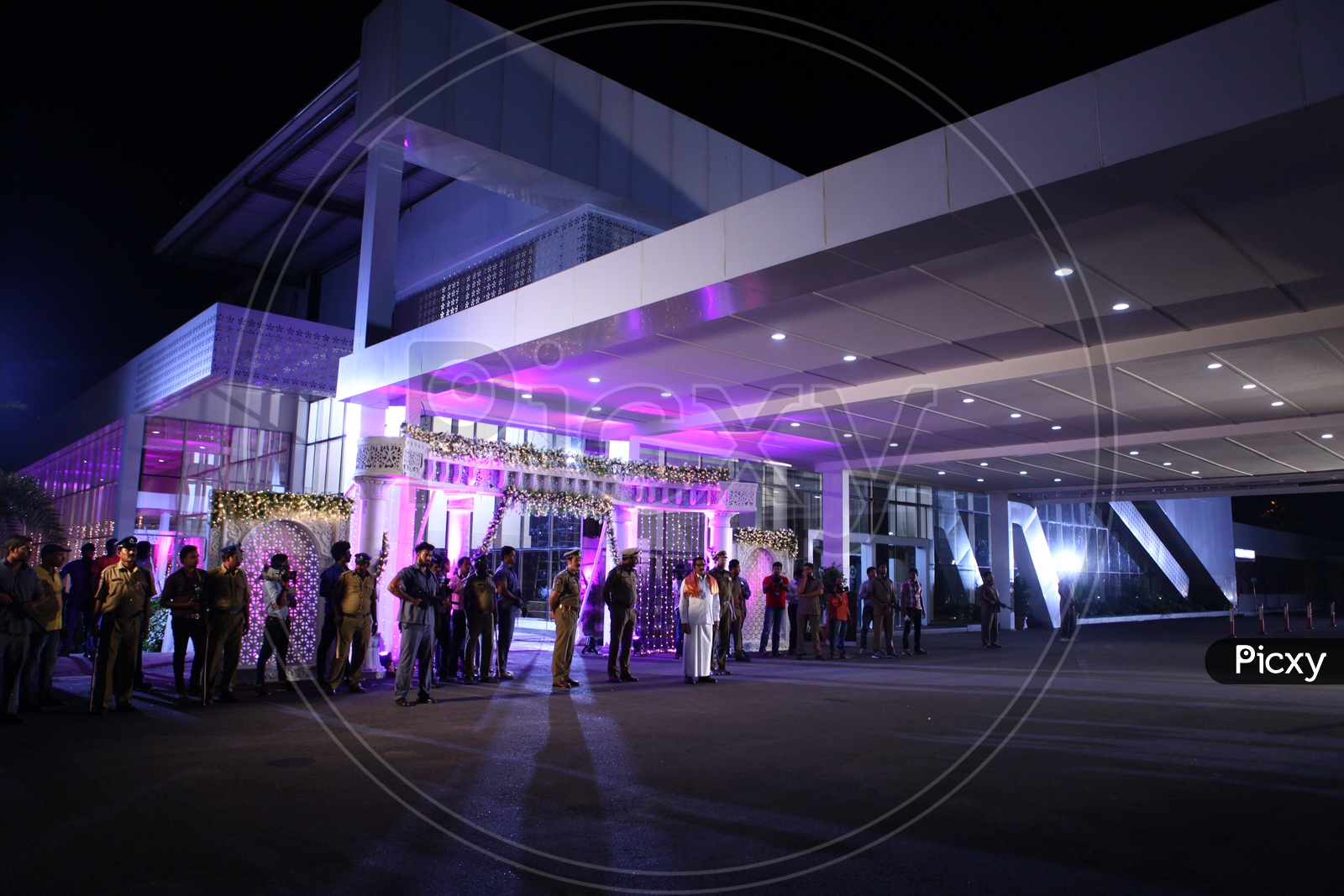 Image of Minister and his security guards waiting at the function hall ...