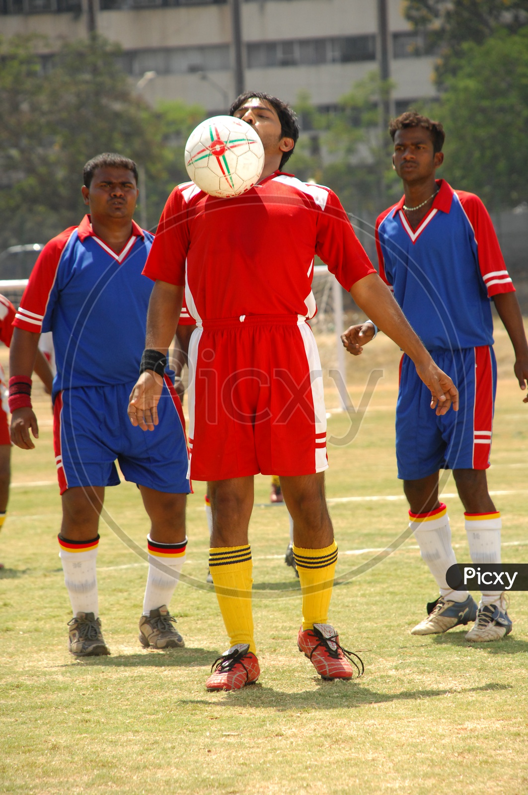 Image of Telugu Movie Actors playing Football-AR897850-Picxy