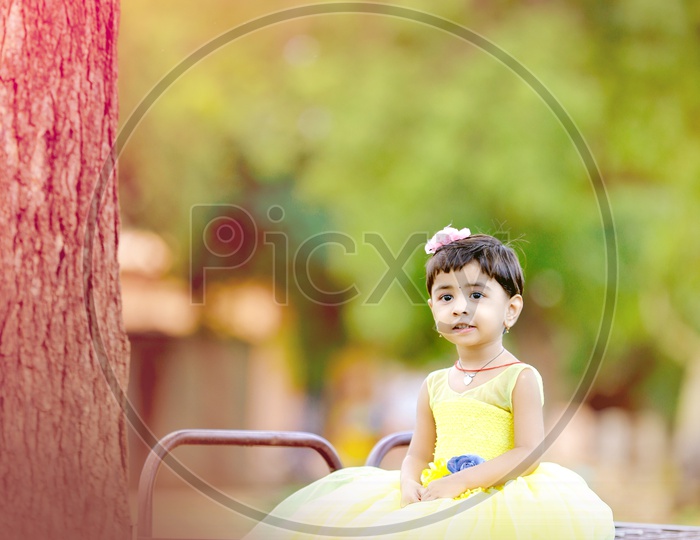Image of Indian Cute Girl Child Wearing Frock with an Expression on ...