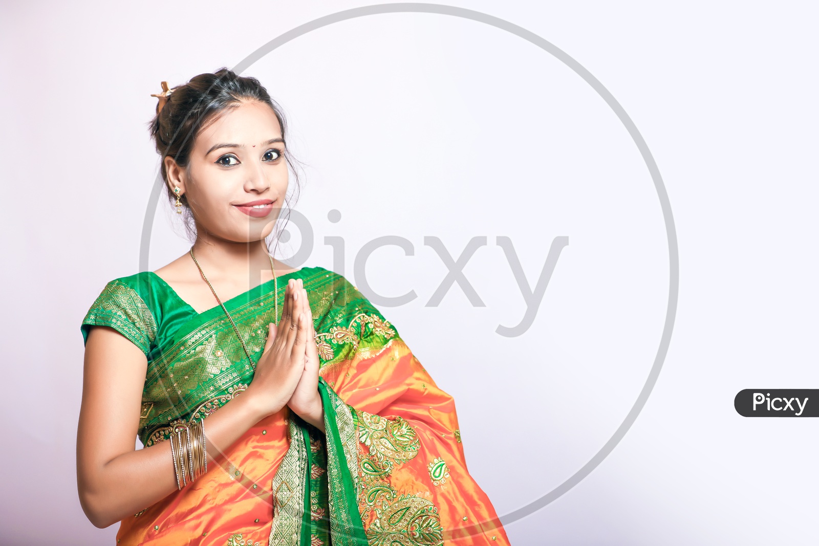 Image of Indian Young Lady Wearing Saree and Saying Namaste Gesture ...