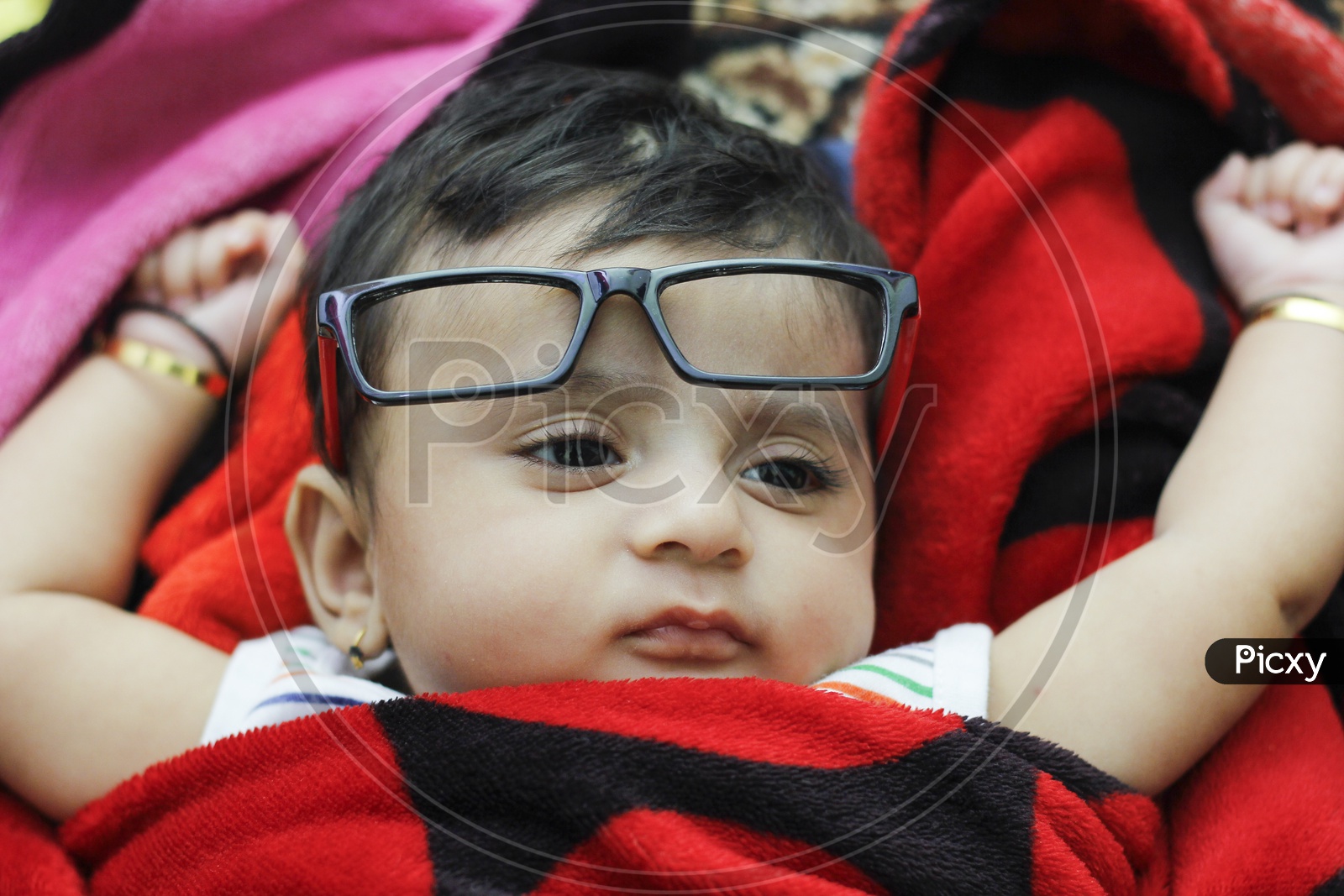 image-of-indian-cute-baby-boy-lying-on-bed-with-cute-expressions-and