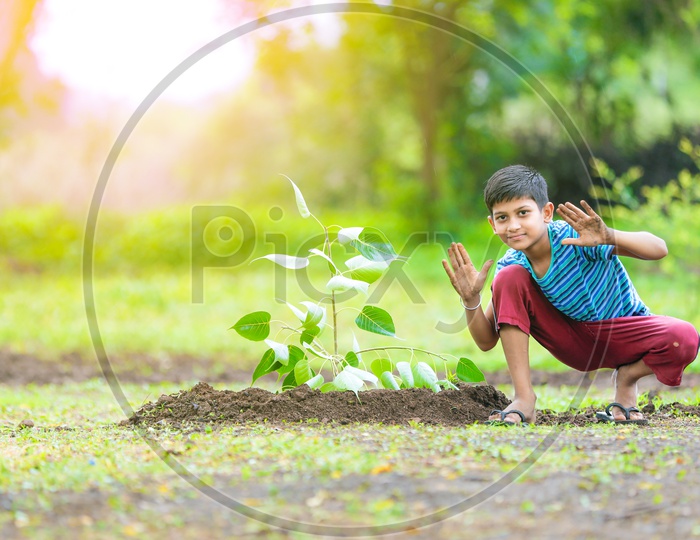 Image of Indian Boy With a Smile on Face near a Newly Planted Plant ...