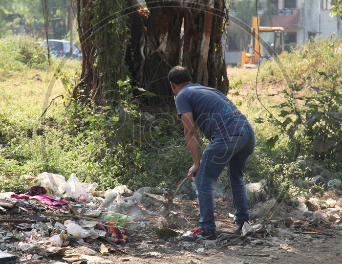 Image of Indian Man Clearing The Road Side garbage-NY145889-Picxy
