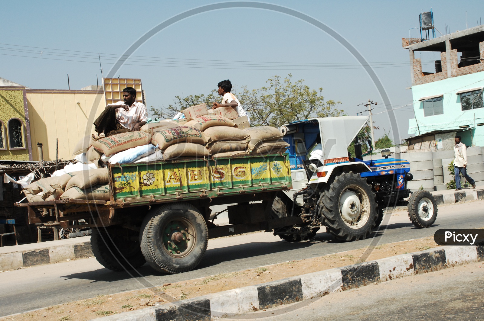 Image of Rice Bags Carrying On a Tractor-AG510433-Picxy