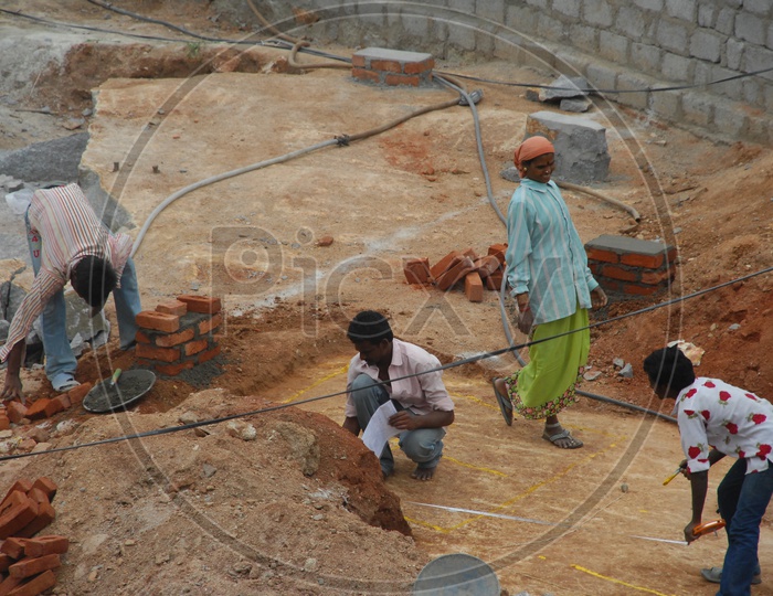 Image of Indian Man at a Construction work Site-ZZ808413-Picxy