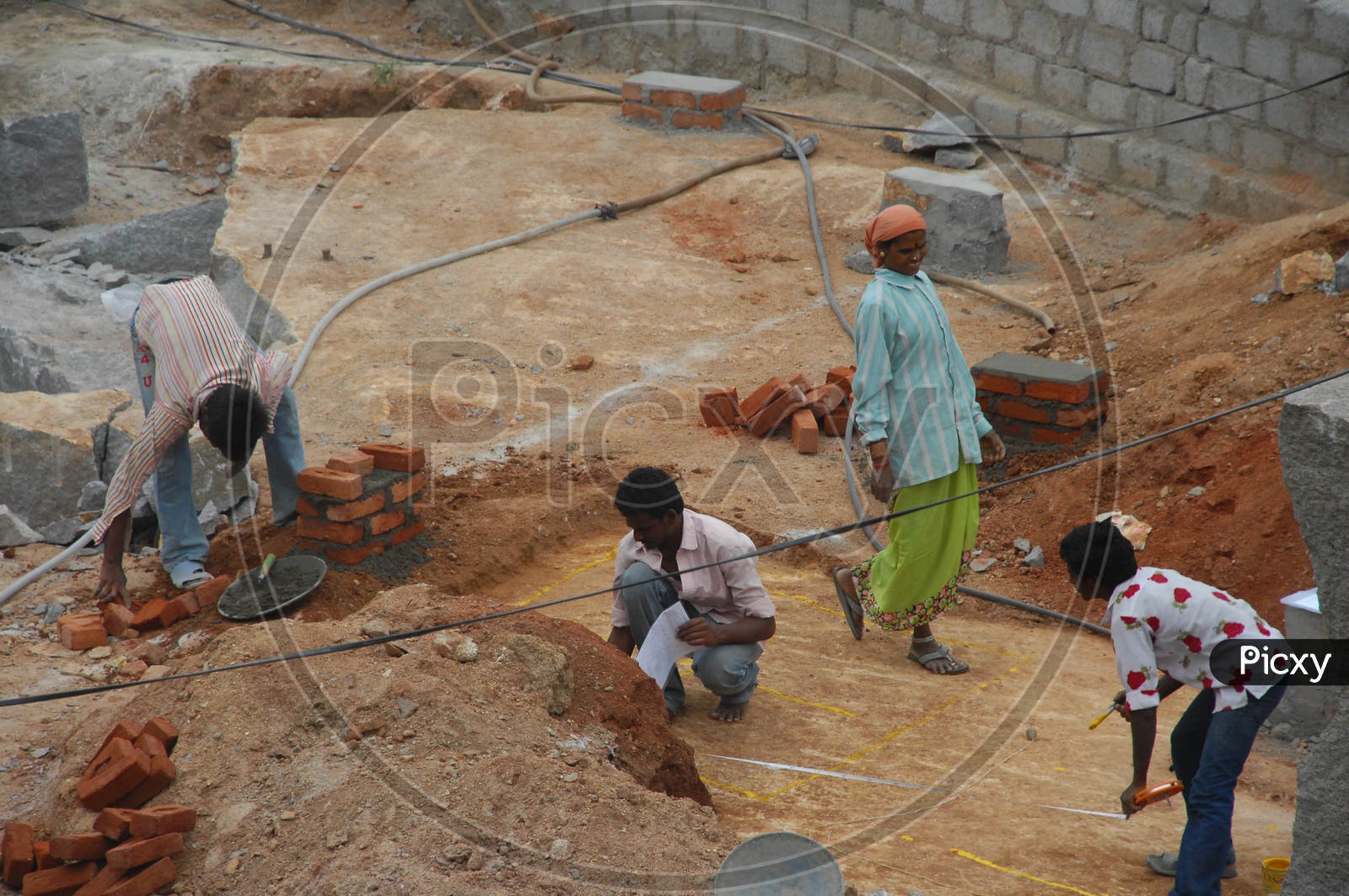Image of Indian Man at a Construction work Site-ZZ808413-Picxy