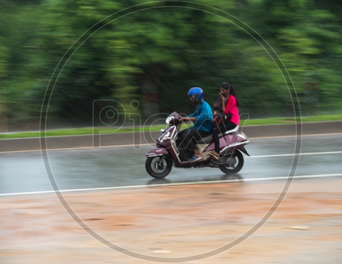 Image of Fast Moving Bikes Or 2 Wheeler in Heavy Rain on National ...