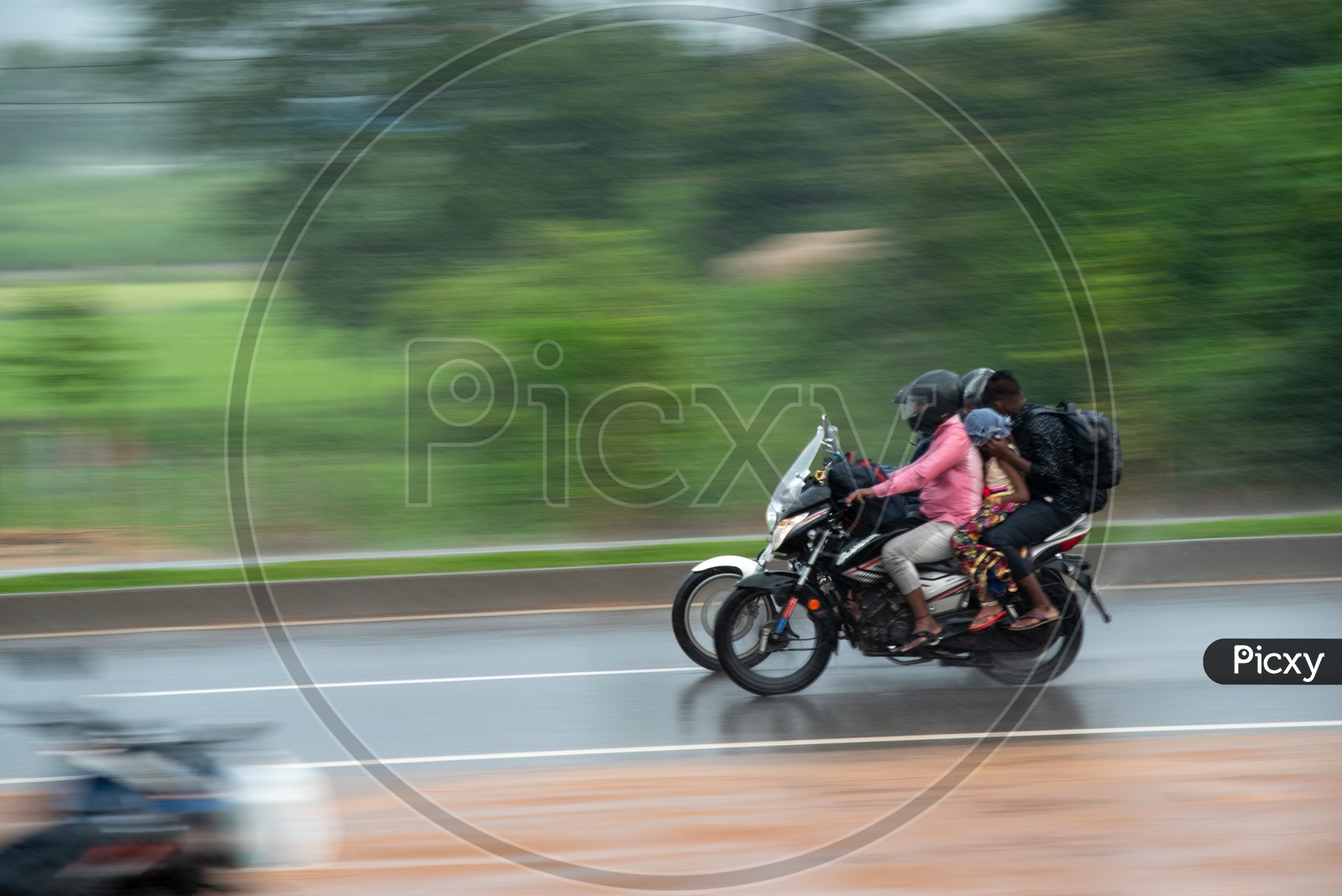 Image of Fast Moving Bikes Or 2 Wheeler in Heavy Rain on National ...
