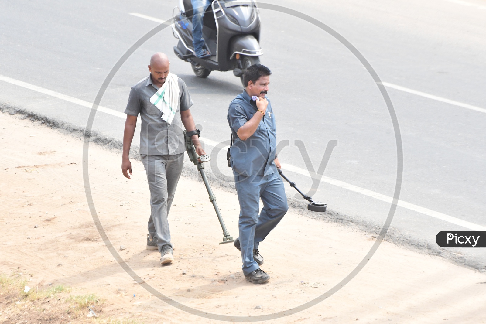 Image of Indian Bomb squad walking on the road-AF869069-Picxy