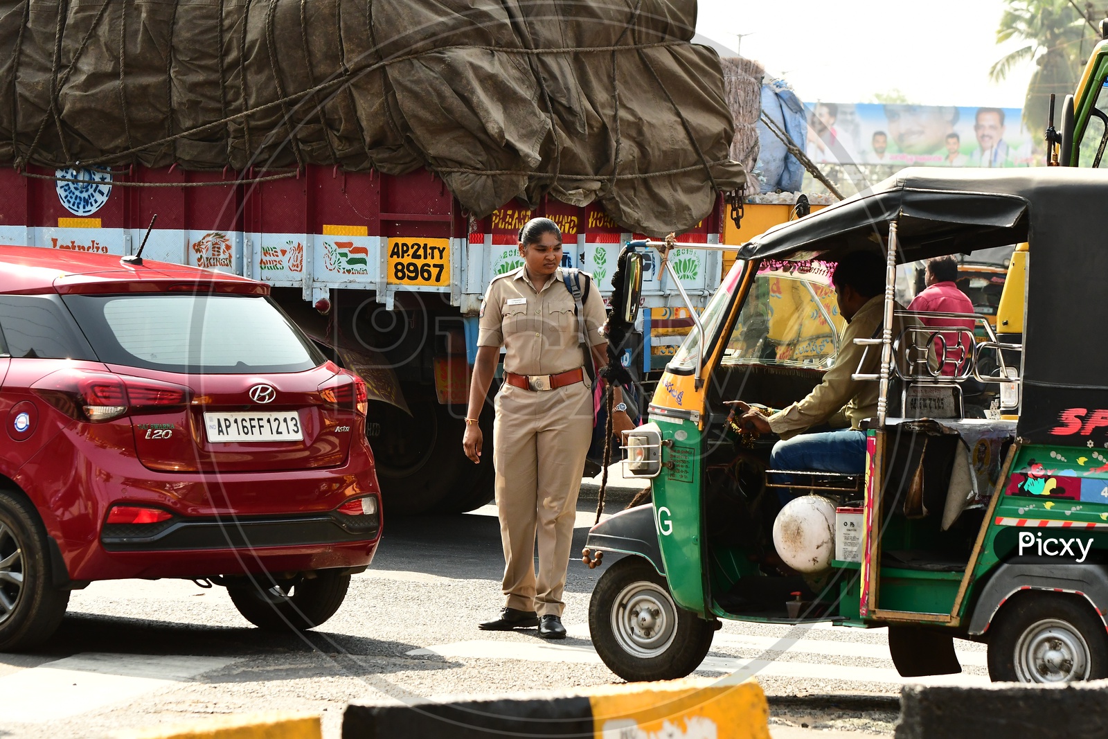 Image of Indian Lady Constable crossing the road-VF829877-Picxy