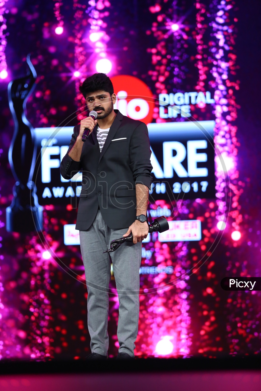 Image Of Malayalam Actors Taking Shields On Stage At Film Fare Awards