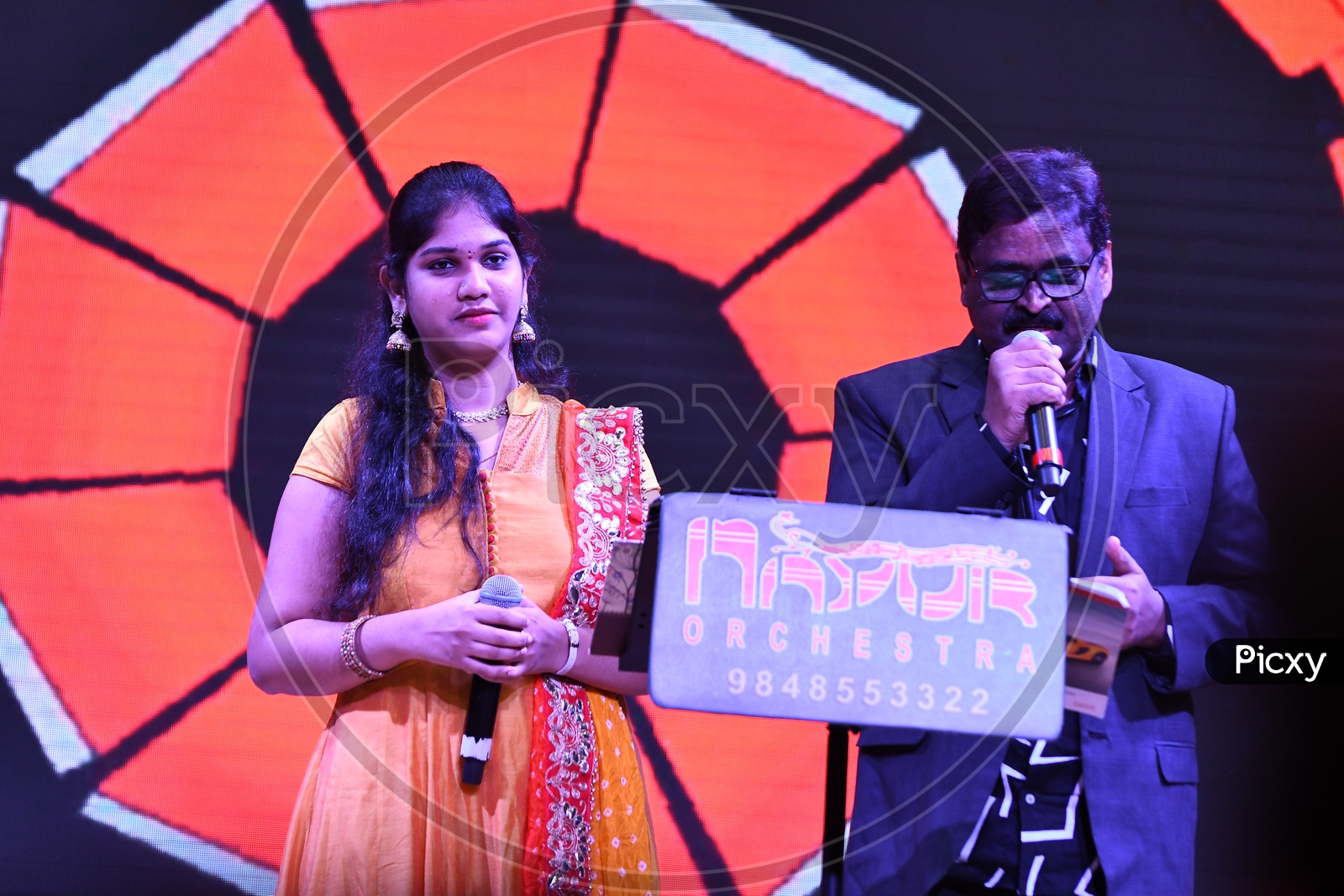 Image of Playback Singers Singing on Stage At an Event-VK900942-Picxy