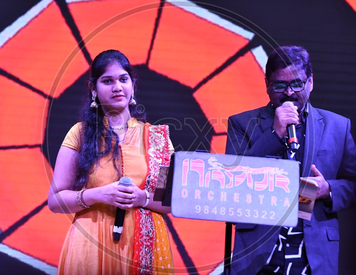 Image of Playback Singers Singing on Stage At an Event-VK900942-Picxy