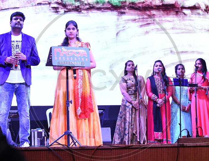 Image of Playback Singers Singing on Stage At an Event-VR210115-Picxy