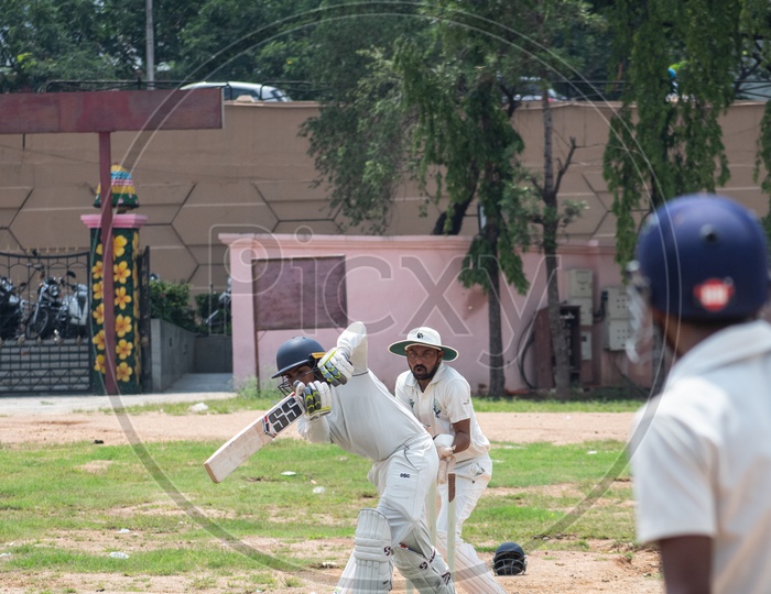 Image of Young Indian Cricket Players Playing Cricket Match In a Ground ...