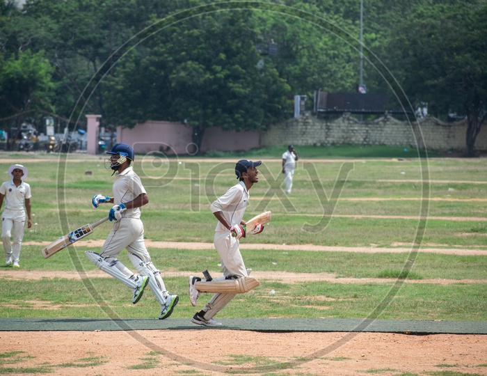 Image of Cricket batsmen taking runs-EQ019968-Picxy