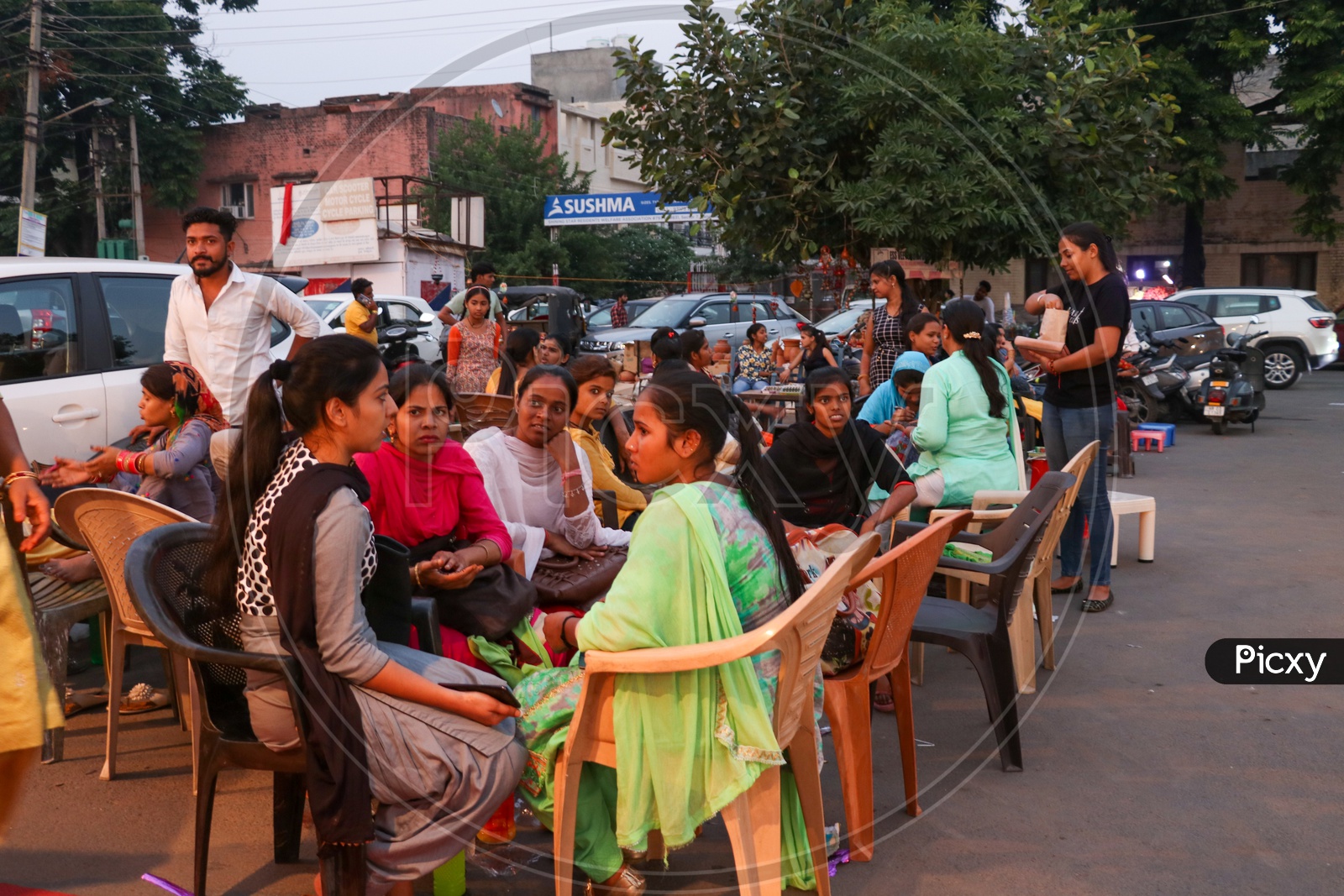 Image of Indian Young Girls Waiting At a Stall-SF533136-Picxy