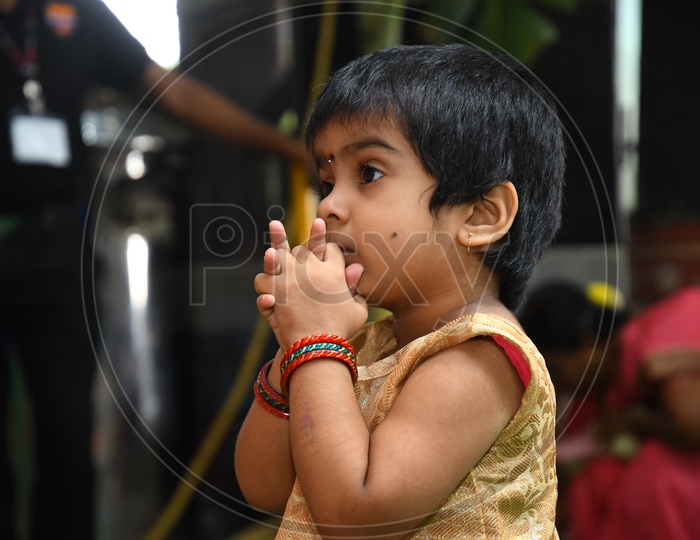 Image of Little Kid in a Temple Praying to God-TR783222-Picxy