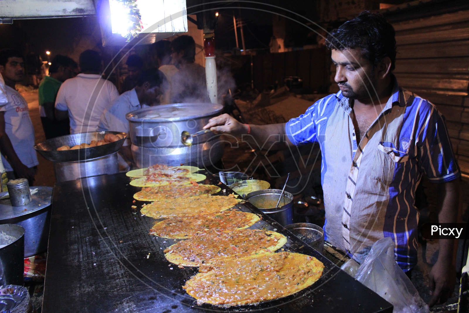 Image of Man Preparing Dosa at A Famous Dosa Stall Called Ram Ki Bandi ...