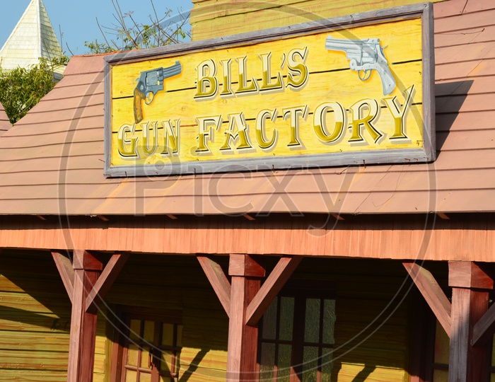 Image of Cow Boy Village Setup With Guns Factory Name Board-RM184967-Picxy