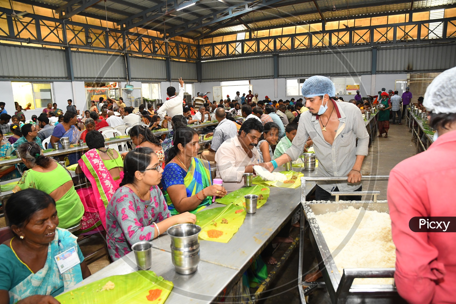 Image of Volunteers Serving Food For Devotees Called As Annadanam Or ...