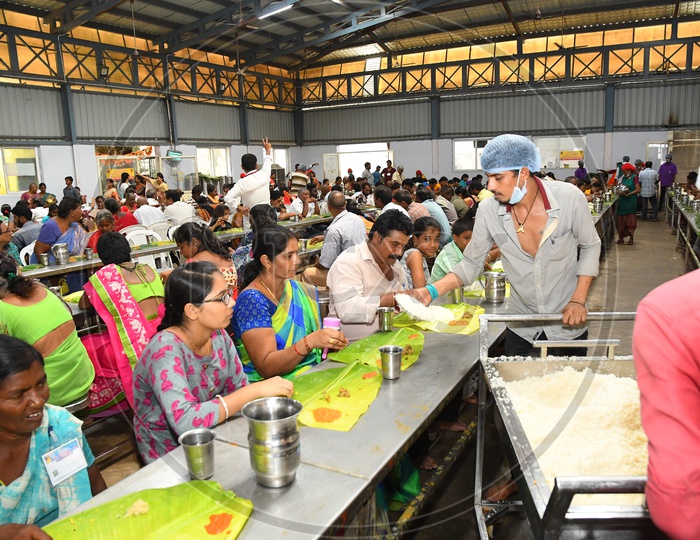 Image of Volunteers Serving Food For Devotees Called As Annadanam Or ...