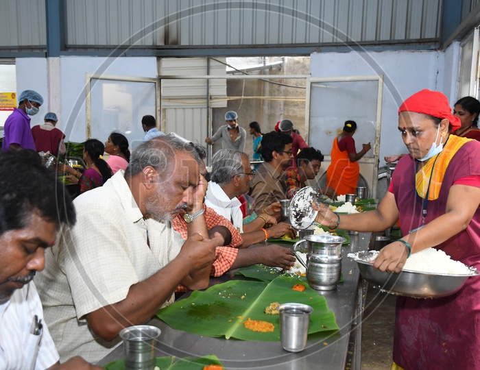 Image of Volunteers Serving Food For Devotees Called As Annadanam Or ...