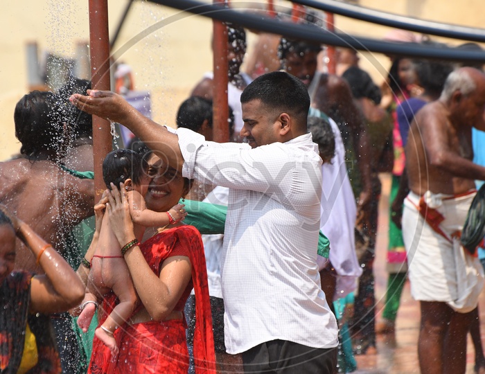 Image of Devotees Taking Bath At Showers Arranged Near Krishna River ...
