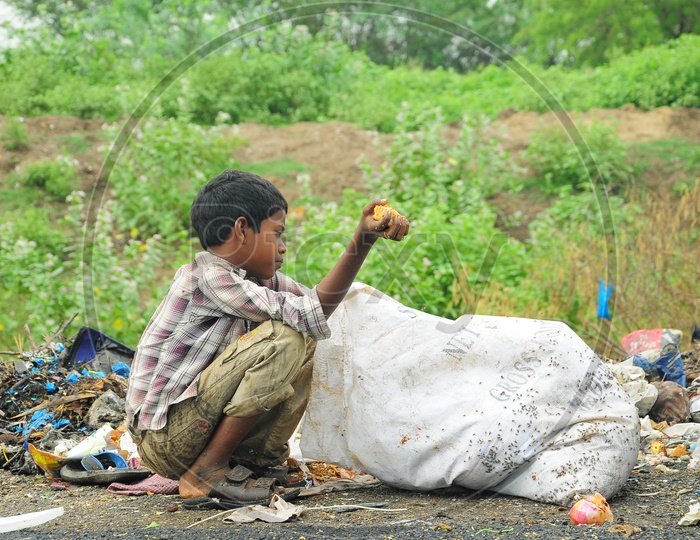 Image of A Rag Picker kid collecting trash-SO165596-Picxy