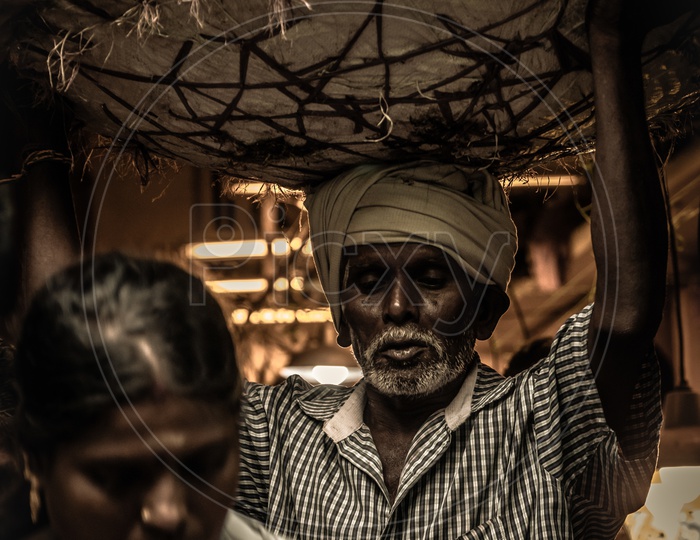Image of Indian Man Carrying Heavy Weights On Head As a Part Of His ...
