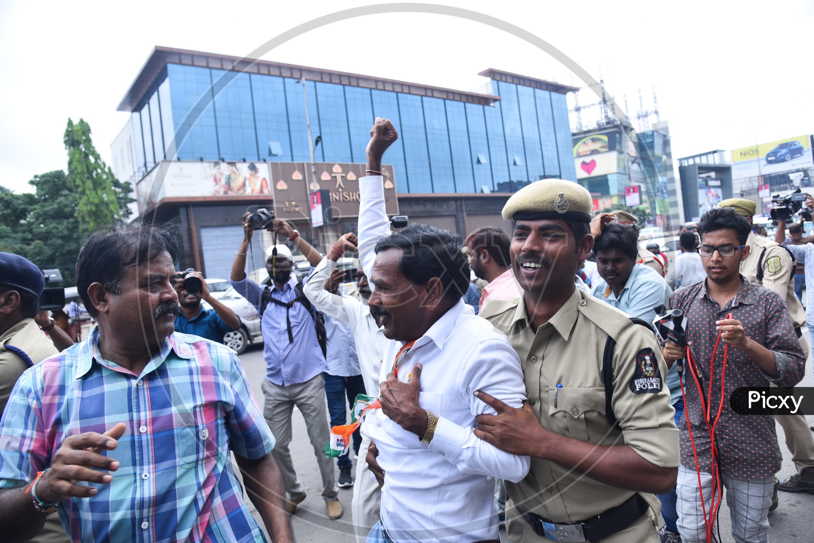 Image of Congress Party workers being detained into a van by Telangana ...