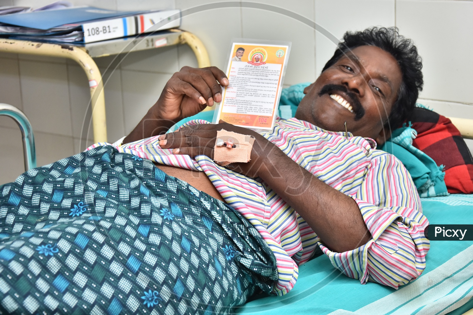 Image of A Happy Beneficiary with NTR Health Card on Hospital Bed ...