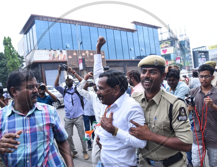 Image of Congress Party workers being detained into a van by Telangana ...