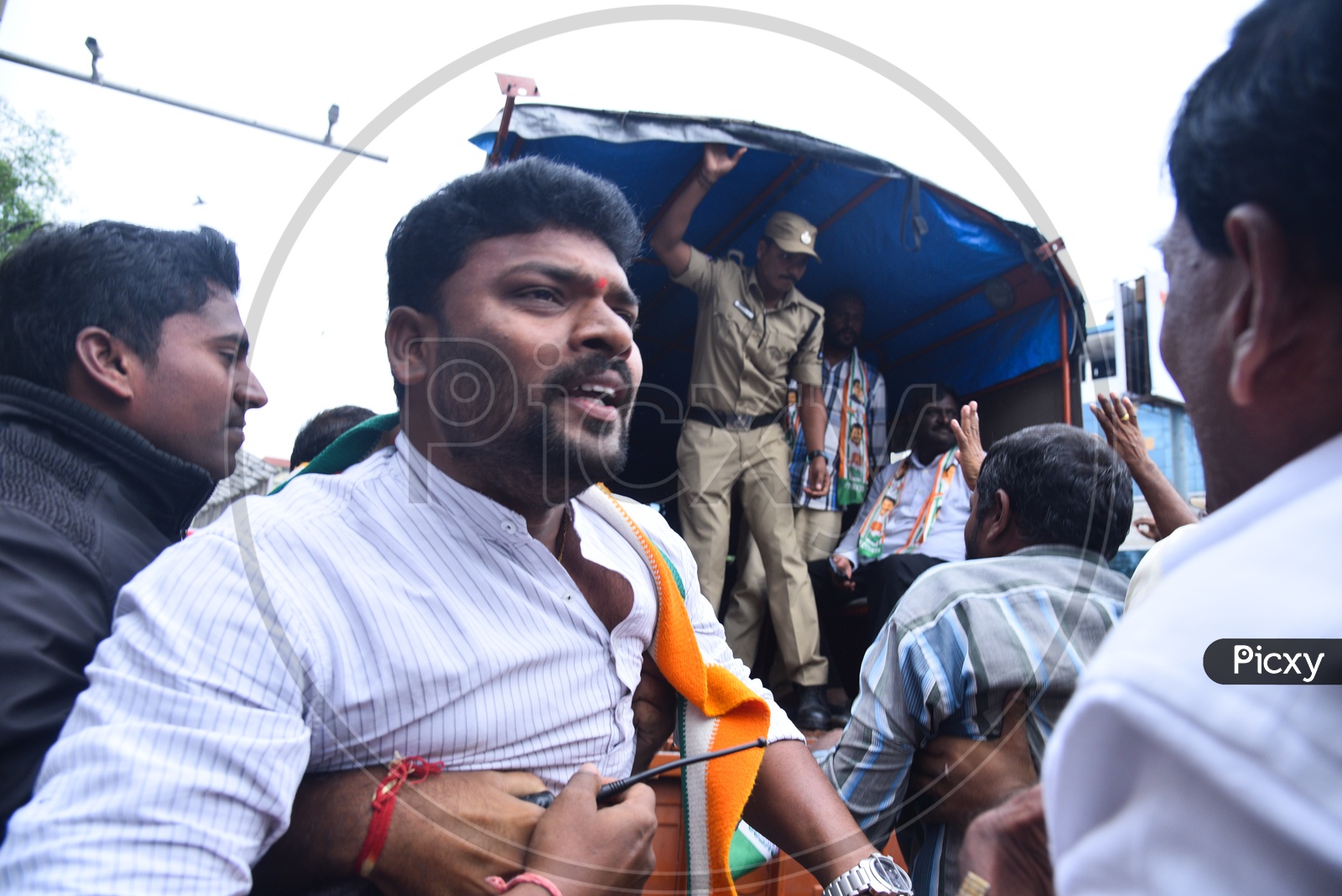 Image of Congress Party workers being detained into a van by Telangana ...