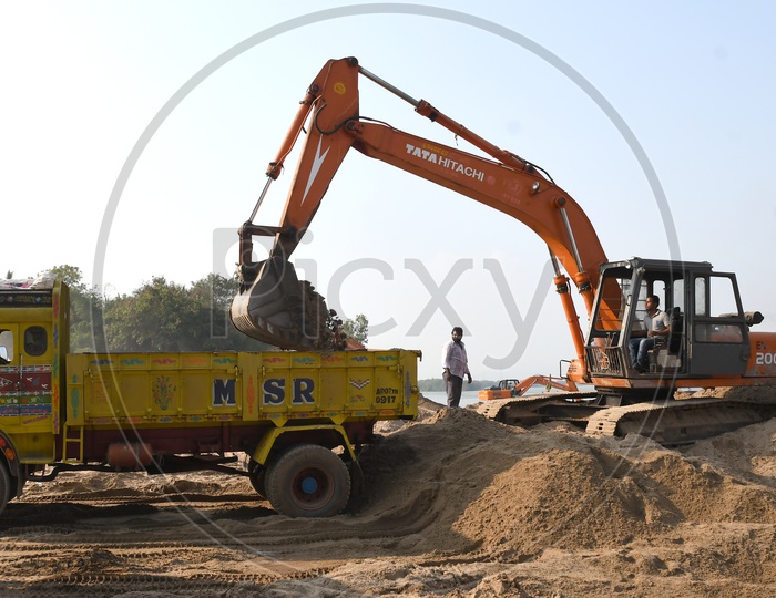 Image of Sand Mining Activities or Dredging At River Or Lake Bed , Sand ...