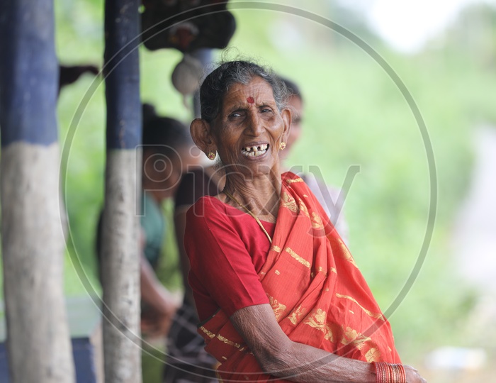 Image of Indian Old Woman smiling with crooked teeth-UA883197-Picxy