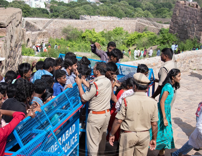 Image of Police man Controlling The crowd Of Devotees At Golconda Fort ...